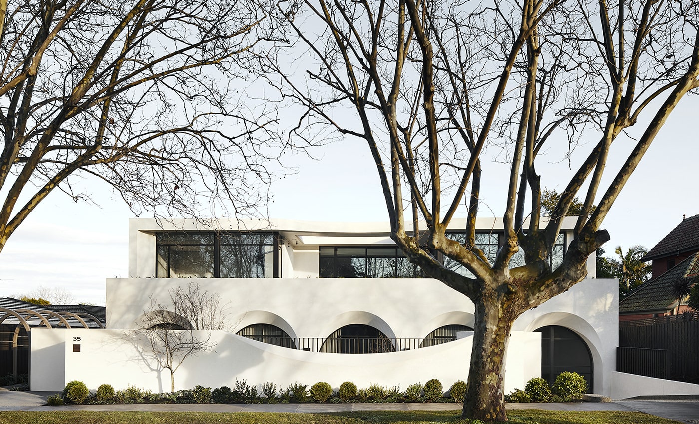 Deep arched windows evoke Italianate villa in Melbourne apartments by ...
